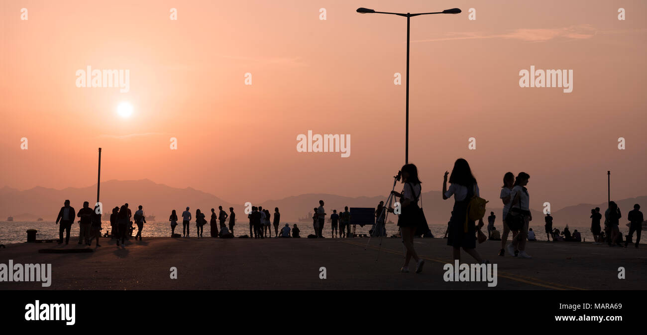 People watching the sunset at Western District Public Cargo Pier (aka ...
