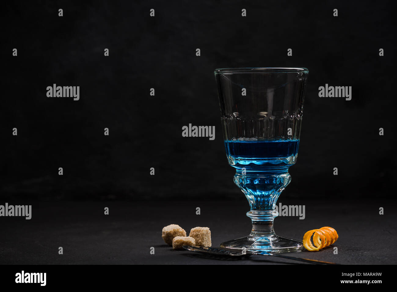 Shoot of blue Absinthe, anise vodka Stock Photo - Alamy