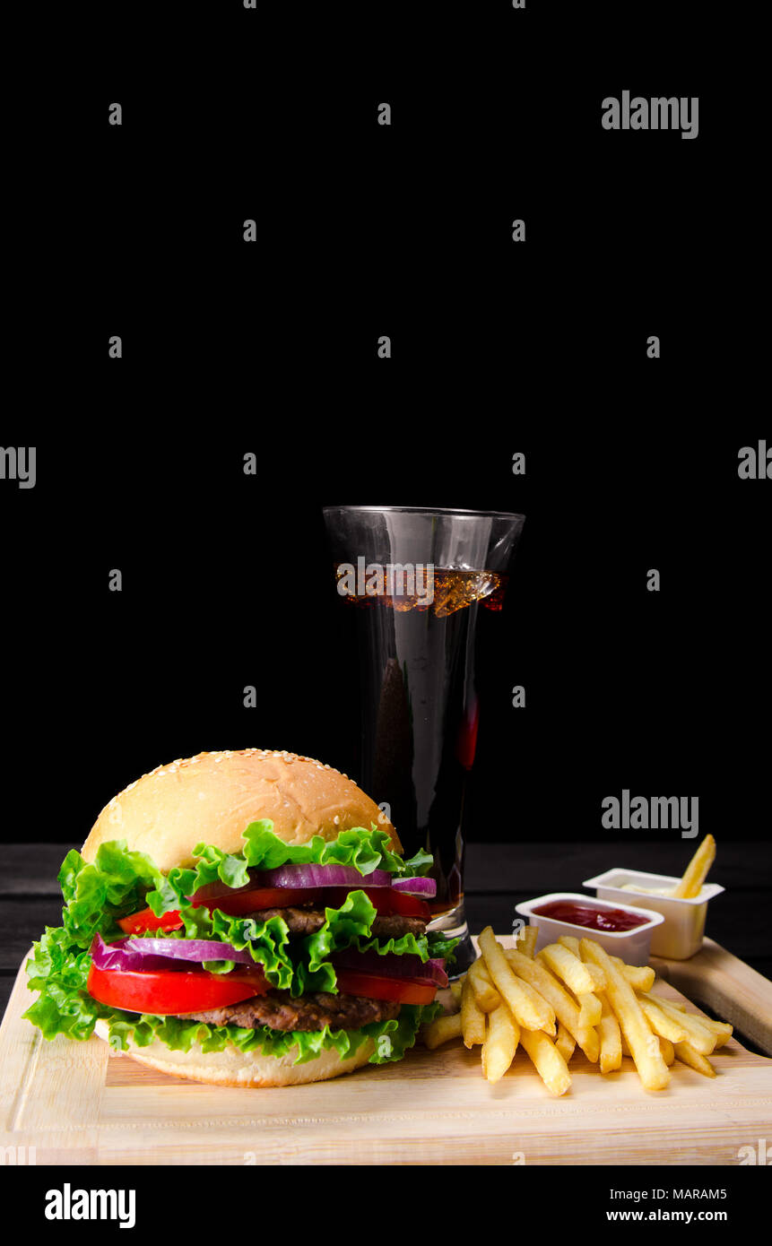 Burger served in bun in nutrition fast food concept Stock Photo - Alamy