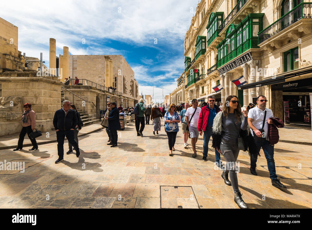 VALLETTA, MALTA - MARCH , 2018: Shoppers and tourist walking on ...