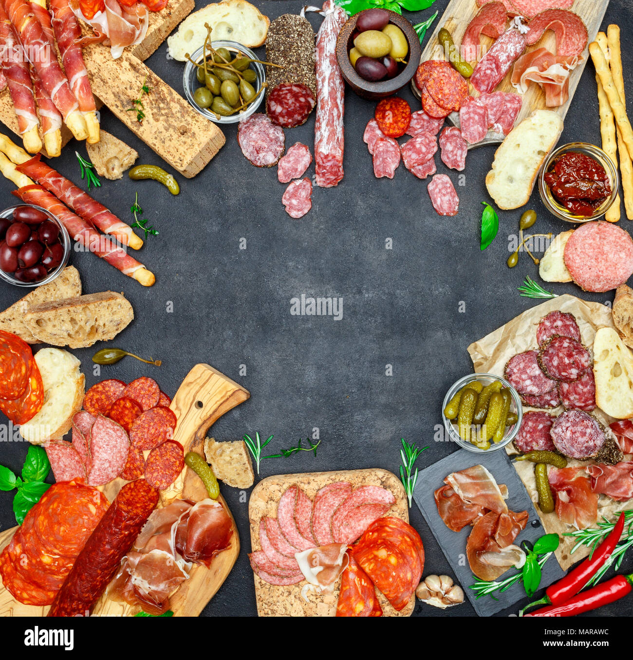 Italian meat appetizer snack set. Salami, prosciutto, bread, olives ...