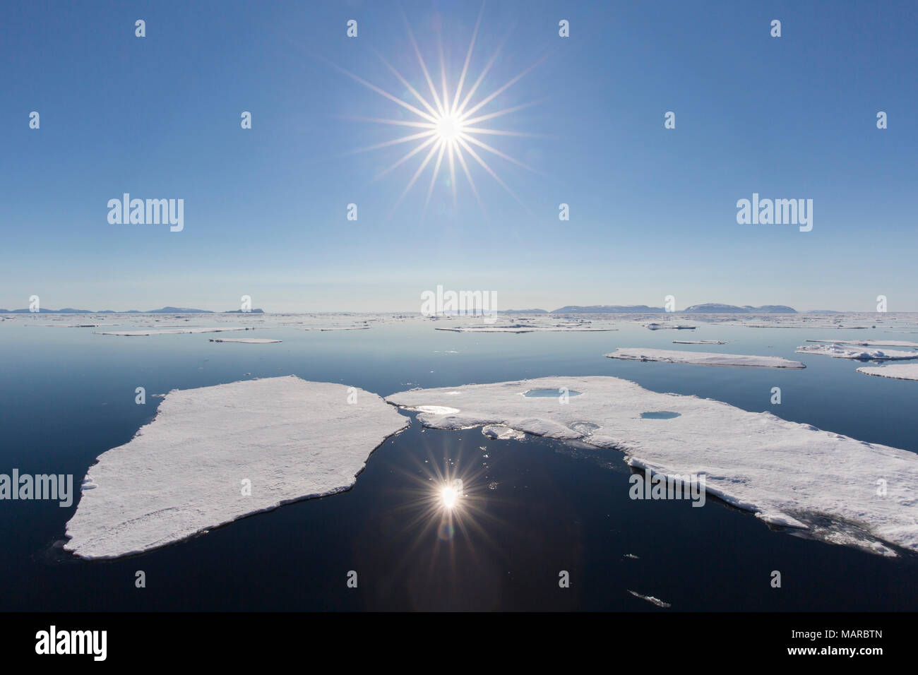 Midnight sun over the Arctic Ocean. Nordaustland, Svalbard, Norway ...