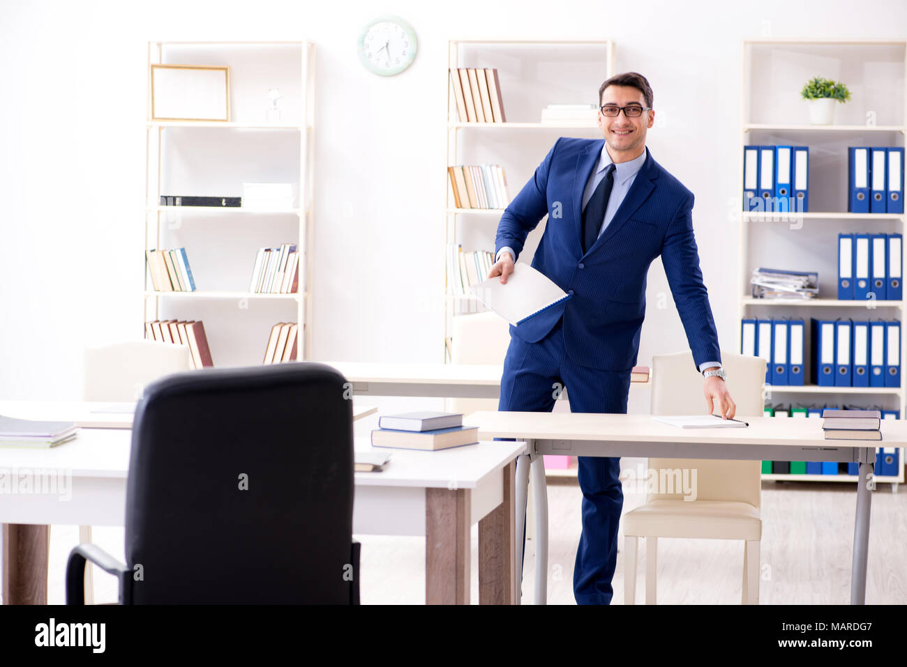 Young handsome businessman employee working in office at desk Stock ...