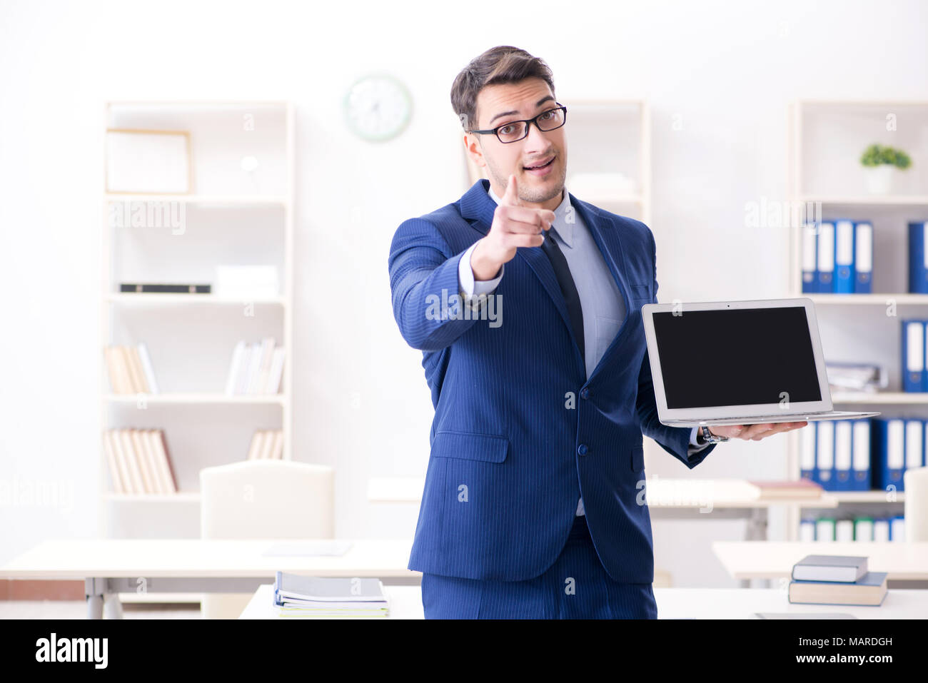 Young handsome businessman employee working in office at desk Stock ...