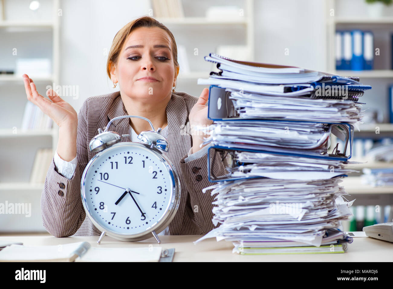 Businesswoman workaholic trying to finish urgent paperwork Stock Photo ...