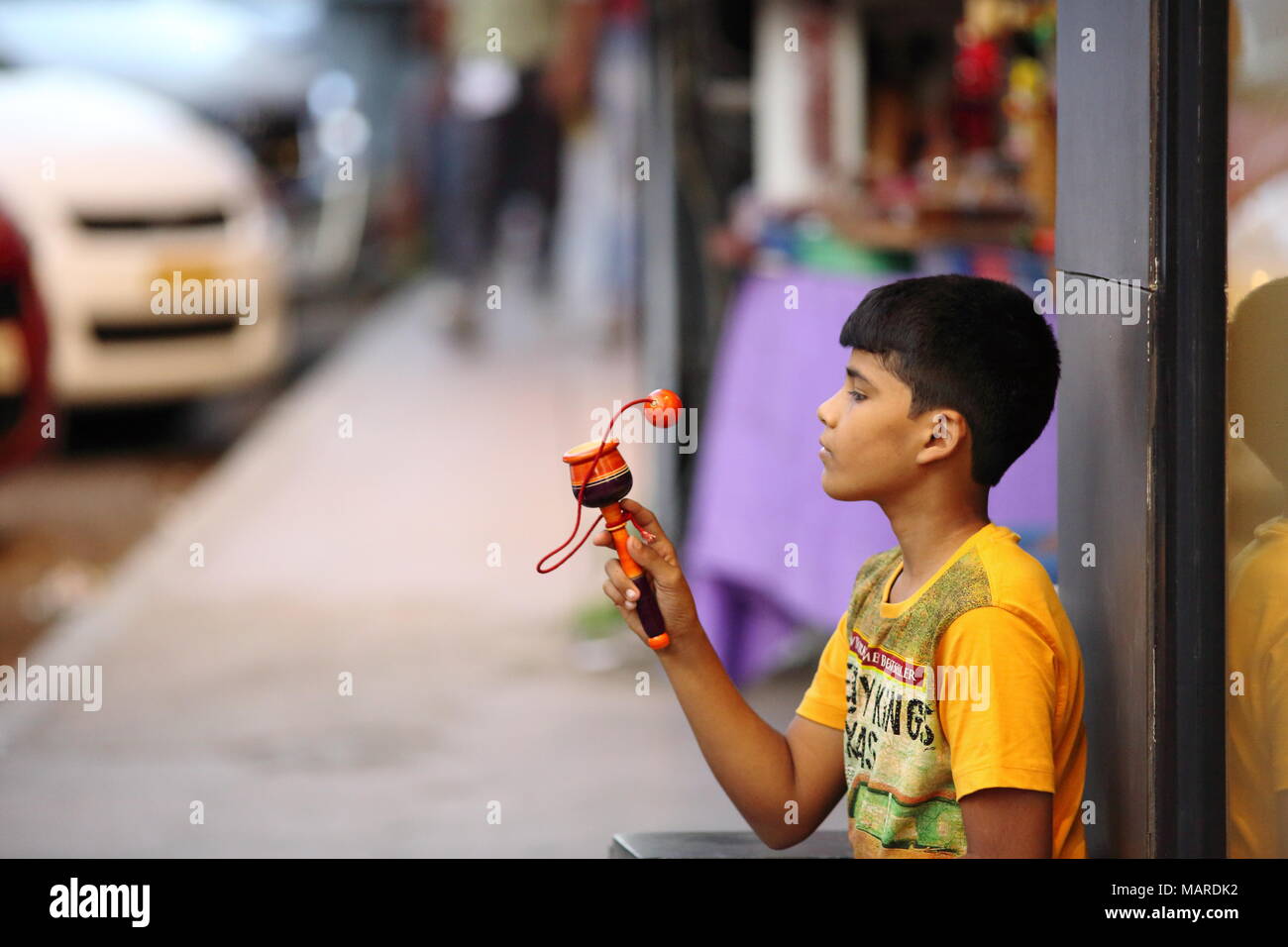 Bangalore, India - October 16, 2016: Unknown kid sitting aside a shop ...