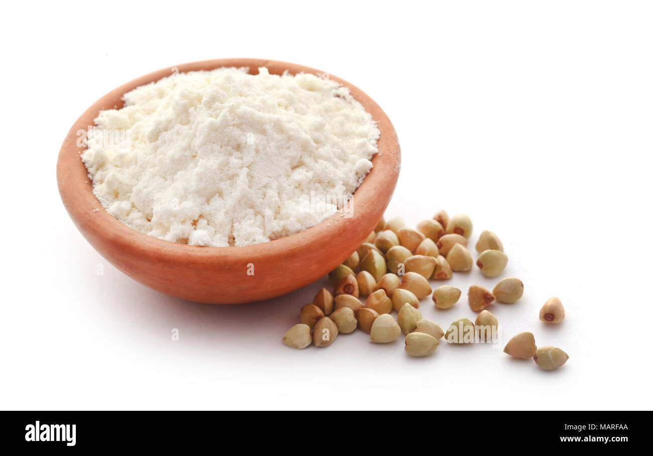 Buckwheat with flour over white background Stock Photo - Alamy