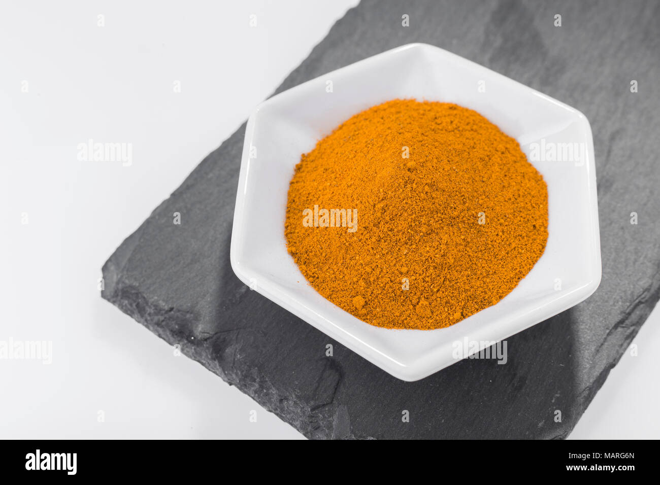 turmeric powder in container - curcuma longa Stock Photo - Alamy