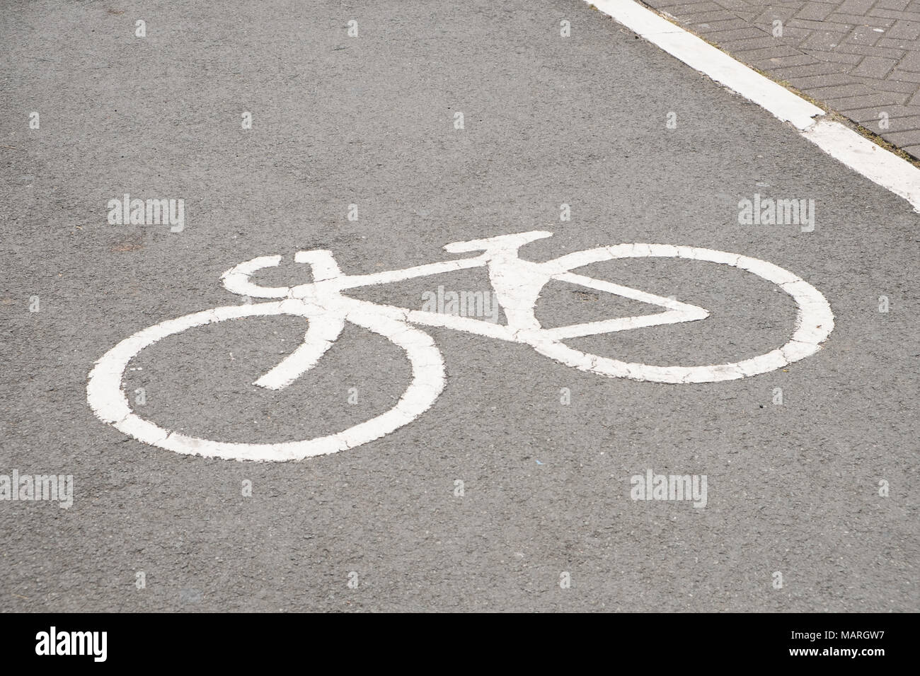 bicycle lane - bicycle symbol on asphalt road Stock Photo - Alamy