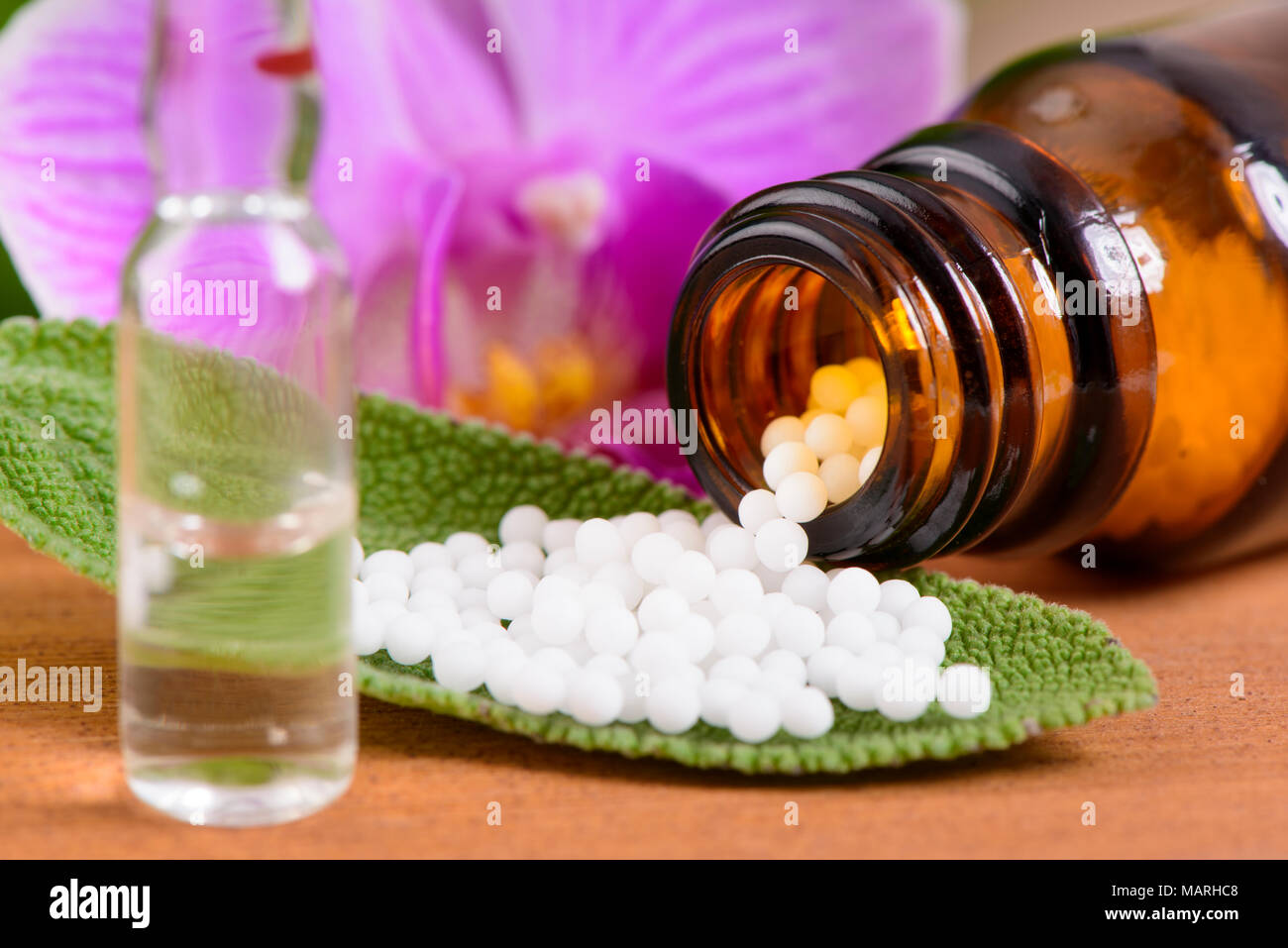 alternative medicine with herbal and homeopathic pills with essence ...
