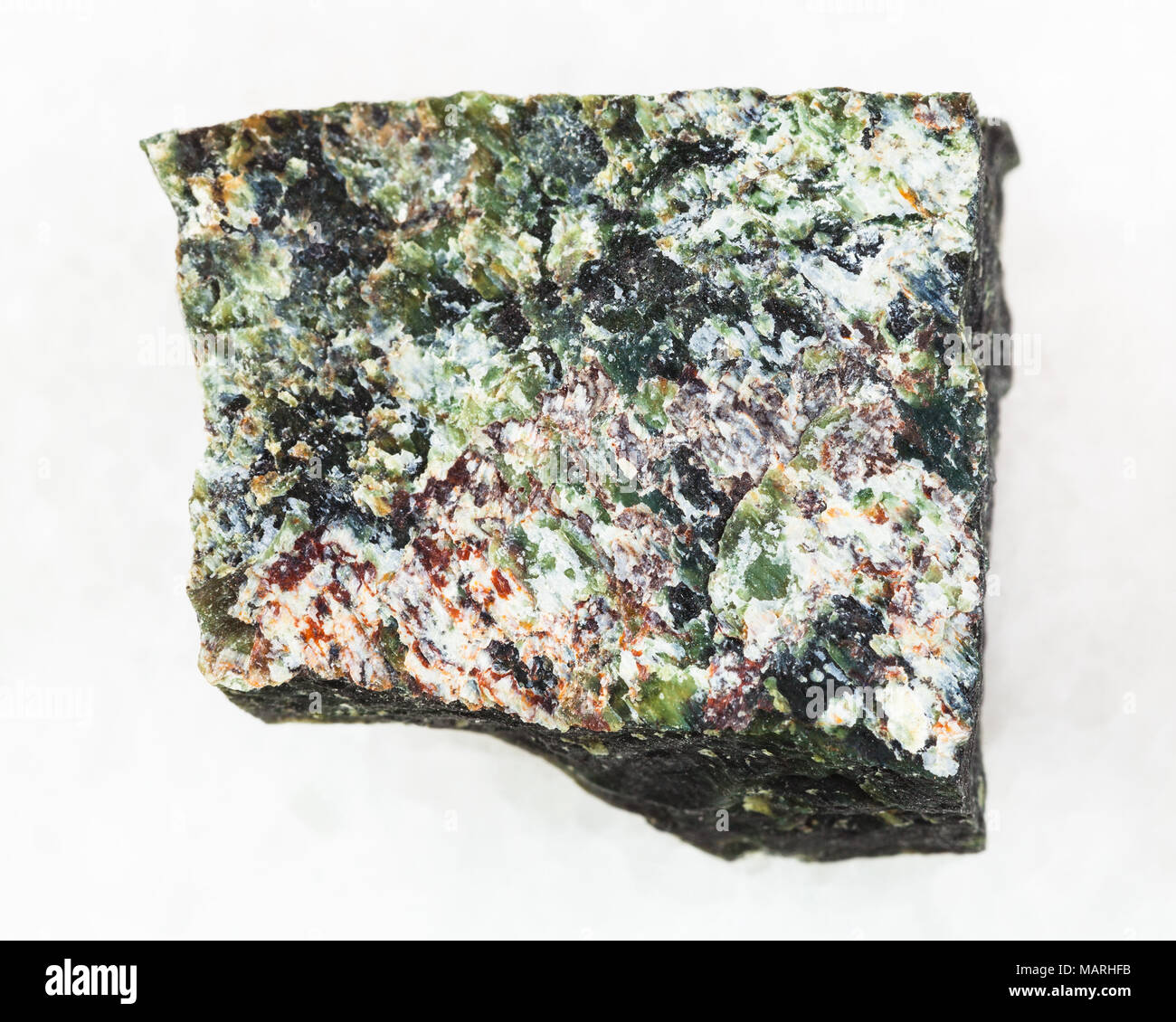 macro shooting of natural mineral rock specimen - rough dunite stone on ...