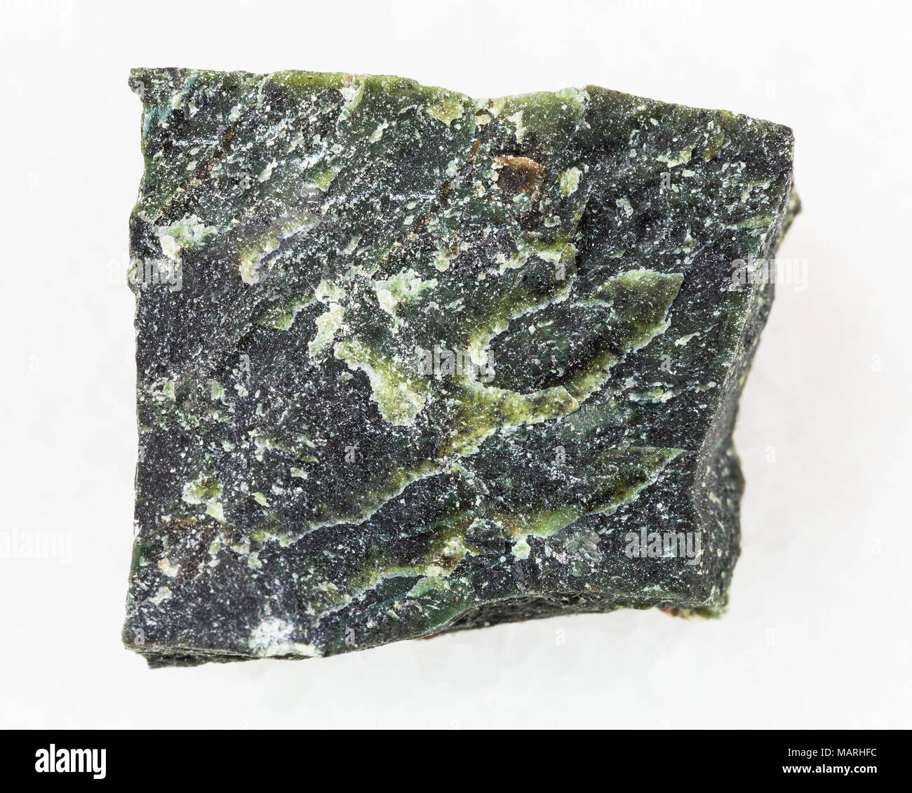 macro shooting of natural mineral rock specimen - raw dunite stone on ...