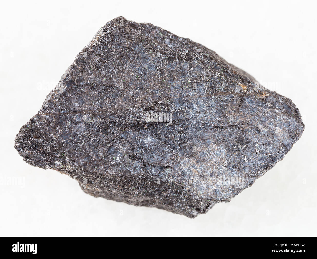 macro shooting of natural mineral rock specimen - raw chromite stone on ...