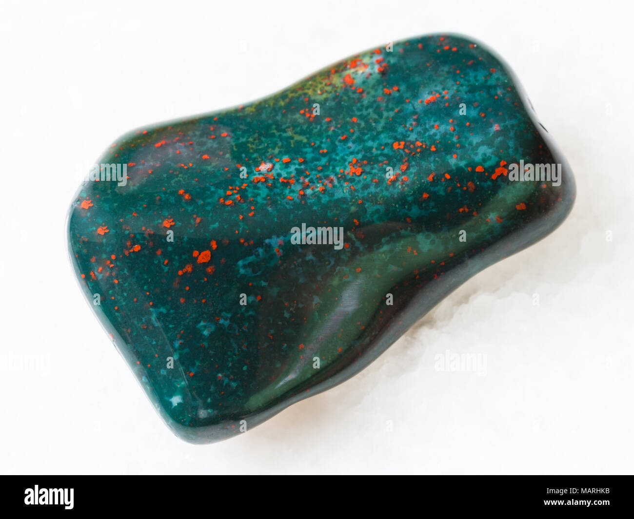 macro shooting of natural mineral rock specimen - tumbled green ...