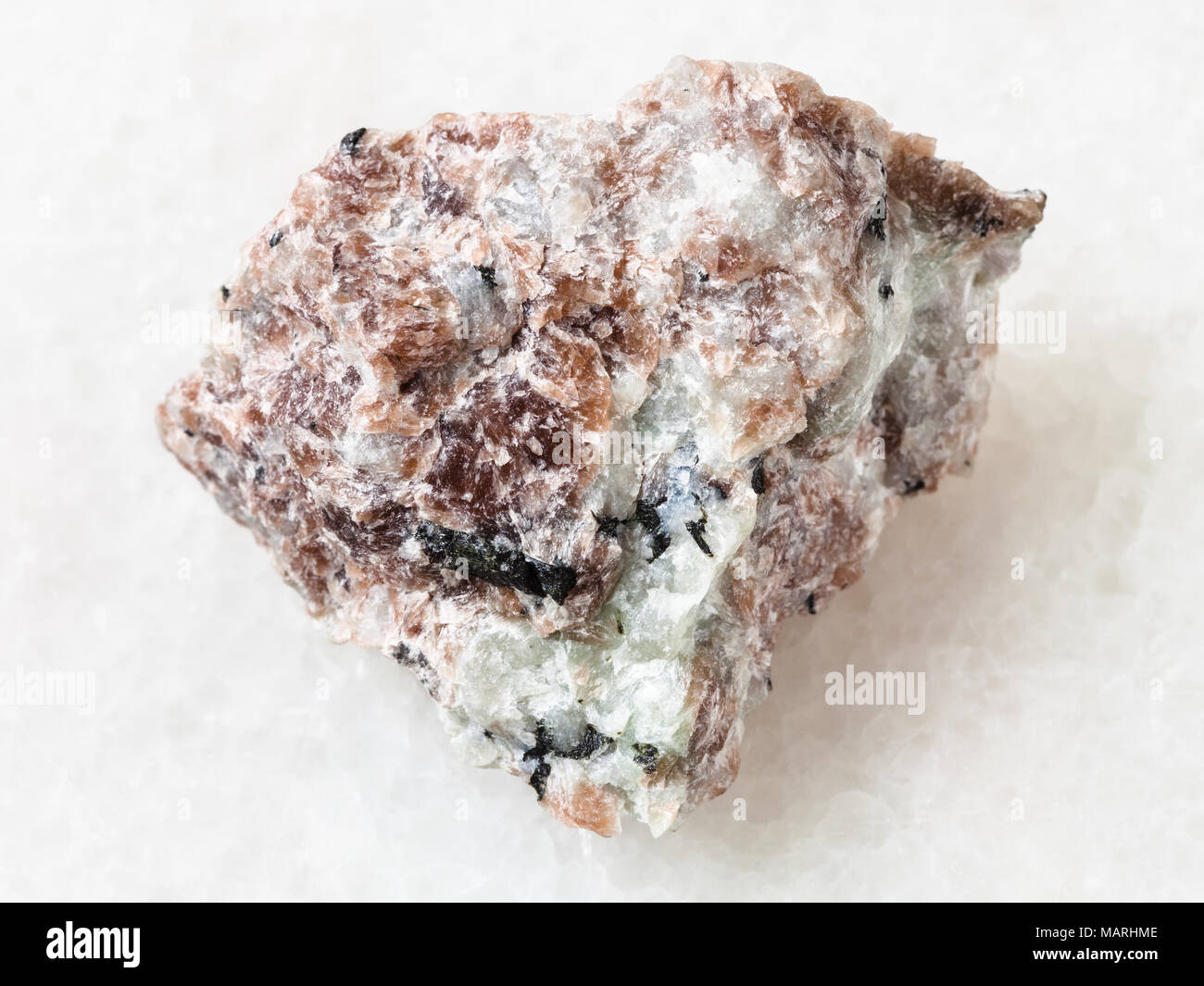 macro shooting of natural mineral rock specimen - raw Miserite stone on ...