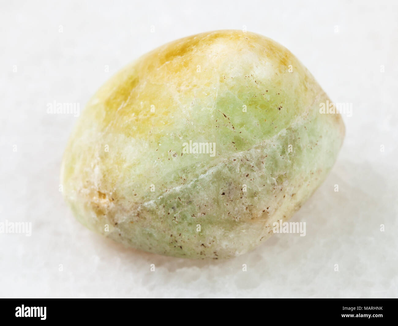 macro shooting of natural mineral rock specimen - tumbled Datolite ...
