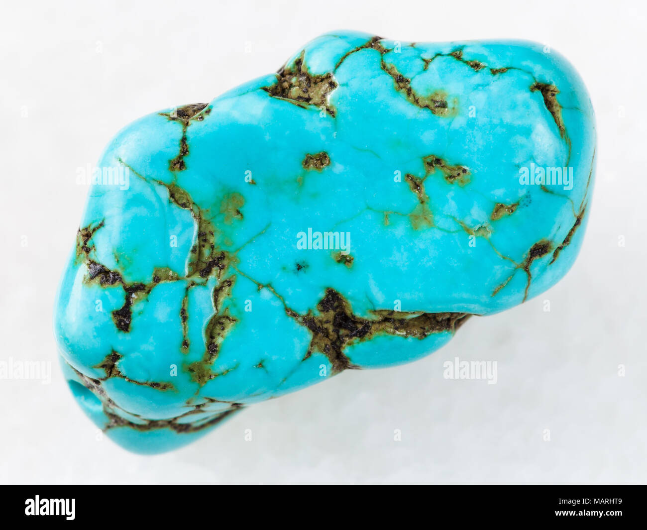 macro shooting of natural mineral rock specimen - tumbled blue howlite ...