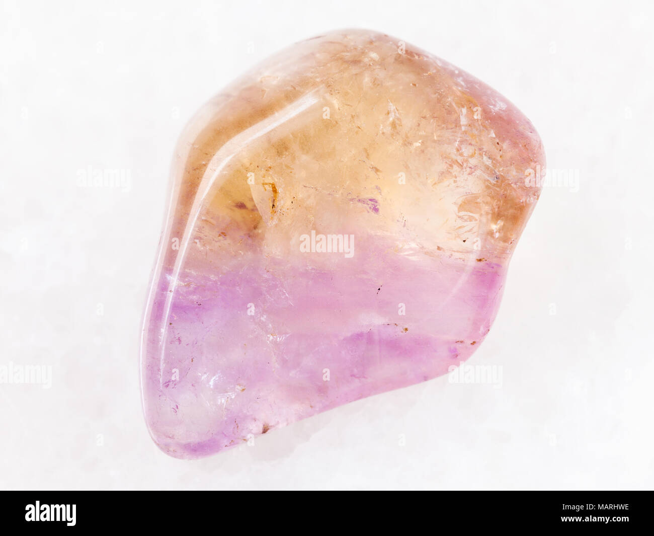 macro shooting of natural mineral rock specimen - tumbled Ametrine ...
