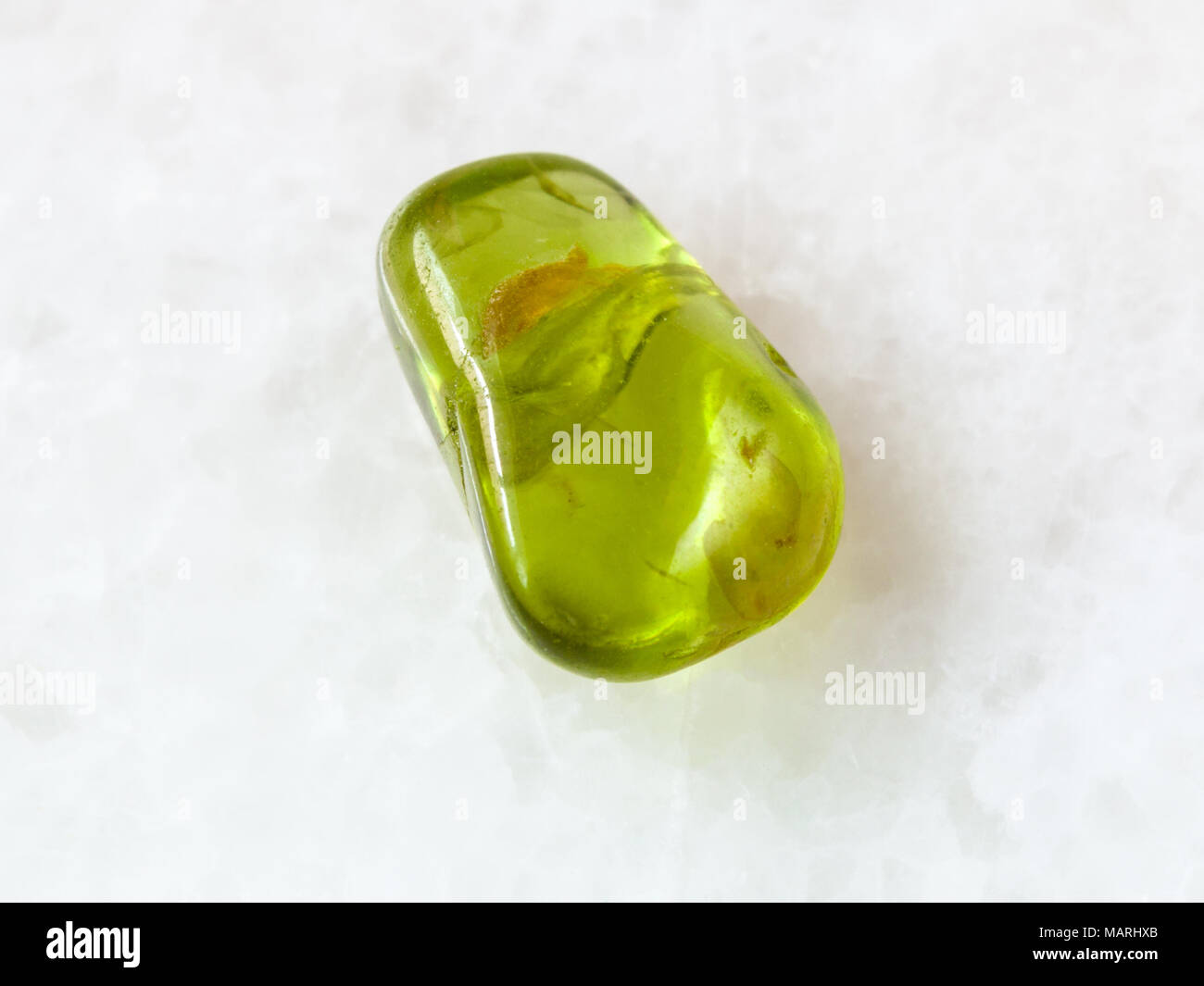 macro shooting of natural mineral rock specimen - polished Peridot gem ...