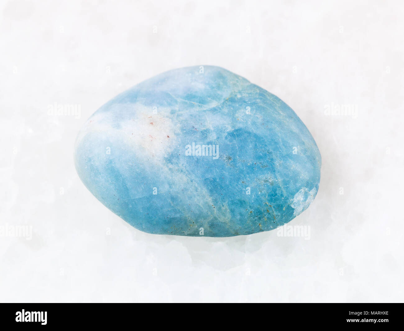 macro shooting of natural mineral rock specimen - polished aquamarine ...