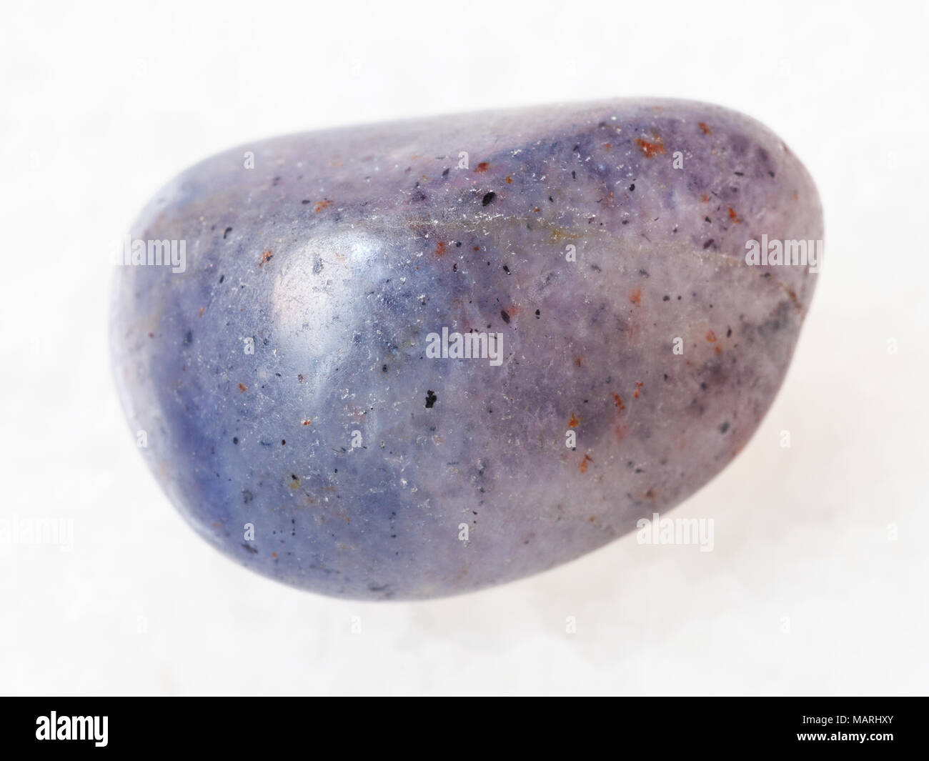 macro shooting of natural mineral rock specimen - tumbled Cordierite ...