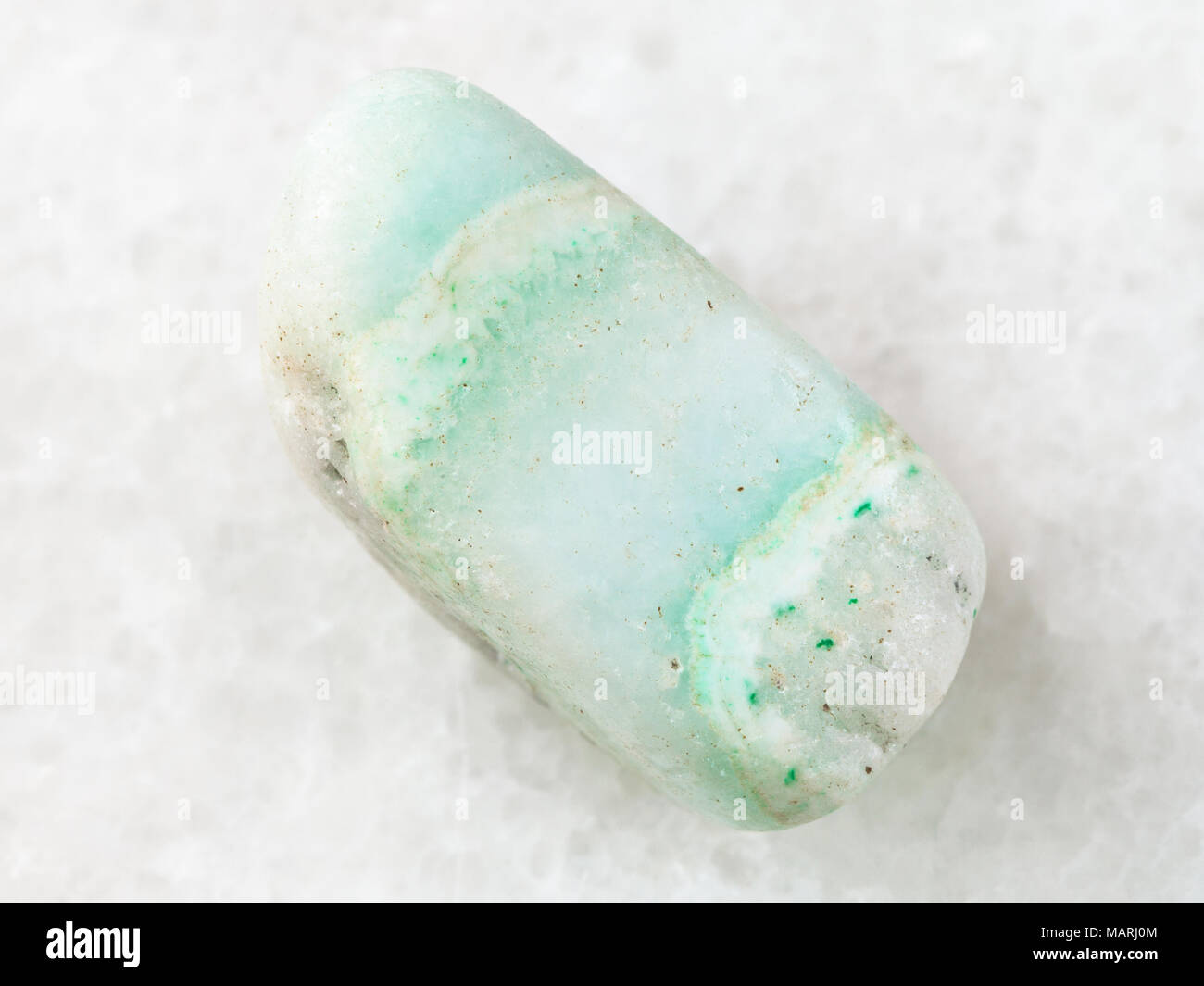 macro shooting of natural mineral rock specimen - tumbled green ...