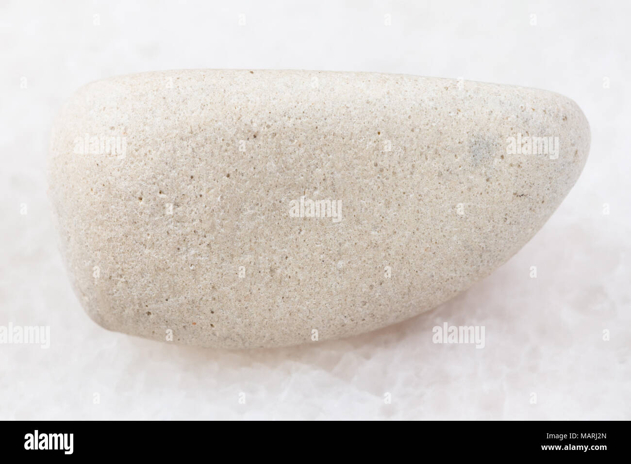 macro shooting of natural mineral rock specimen - tumbled white ...