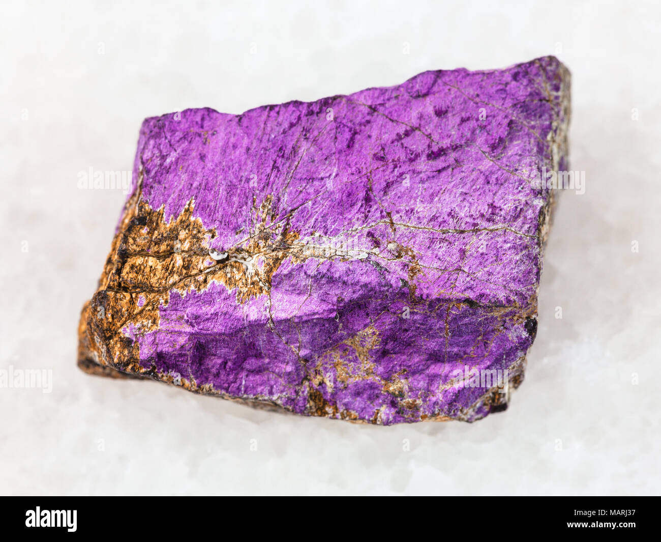 macro shooting of natural mineral rock specimen - rough Purpurite stone ...