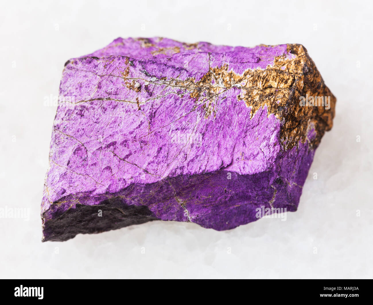 macro shooting of natural mineral rock specimen - Purpurite stone on ...