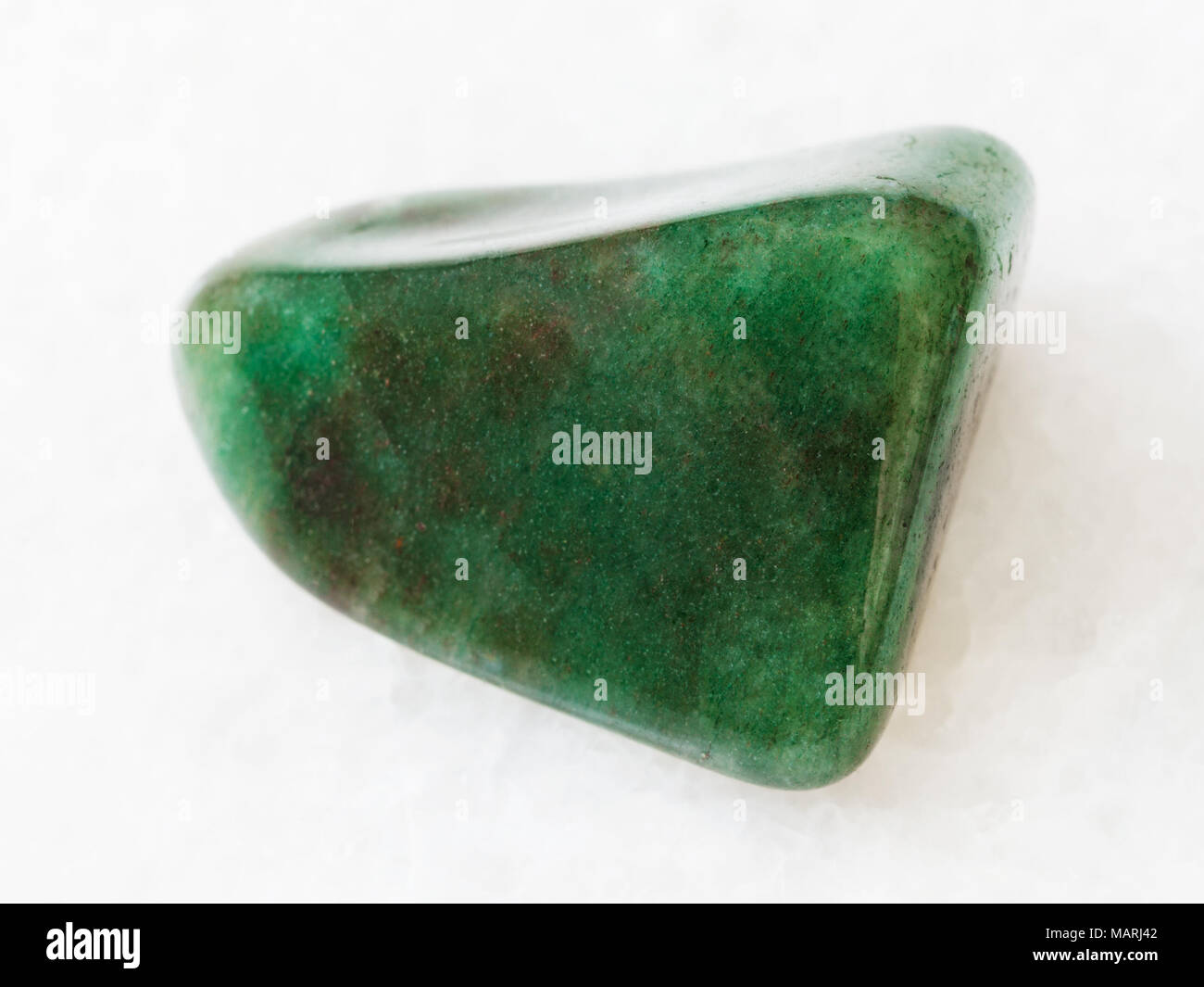 macro shooting of natural mineral rock specimen - tumbled green ...
