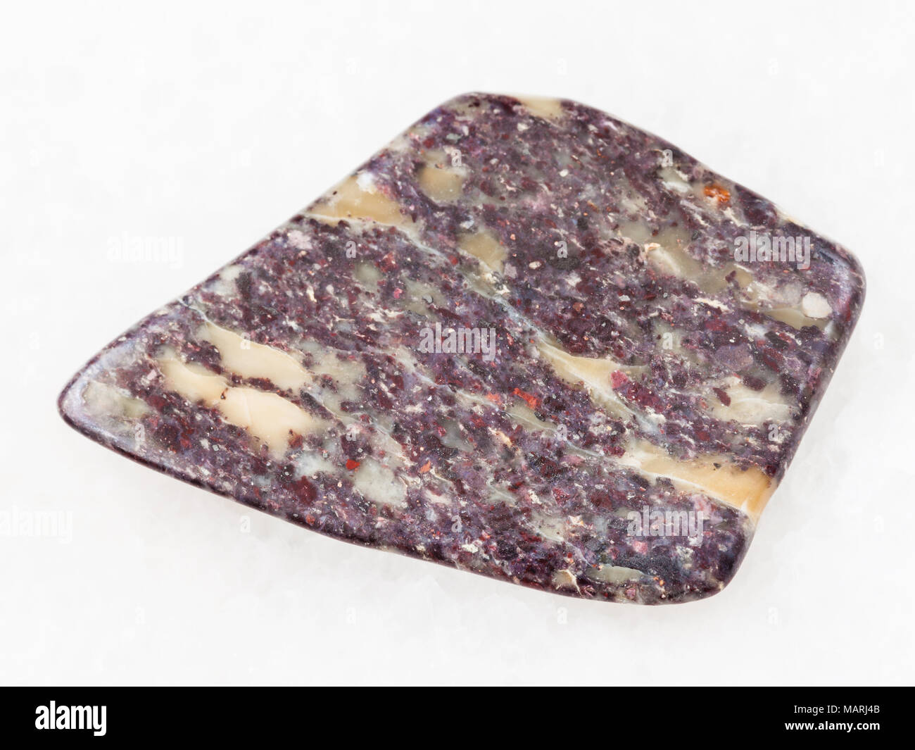 macro shooting of natural mineral rock specimen - tumbled Alunite stone ...