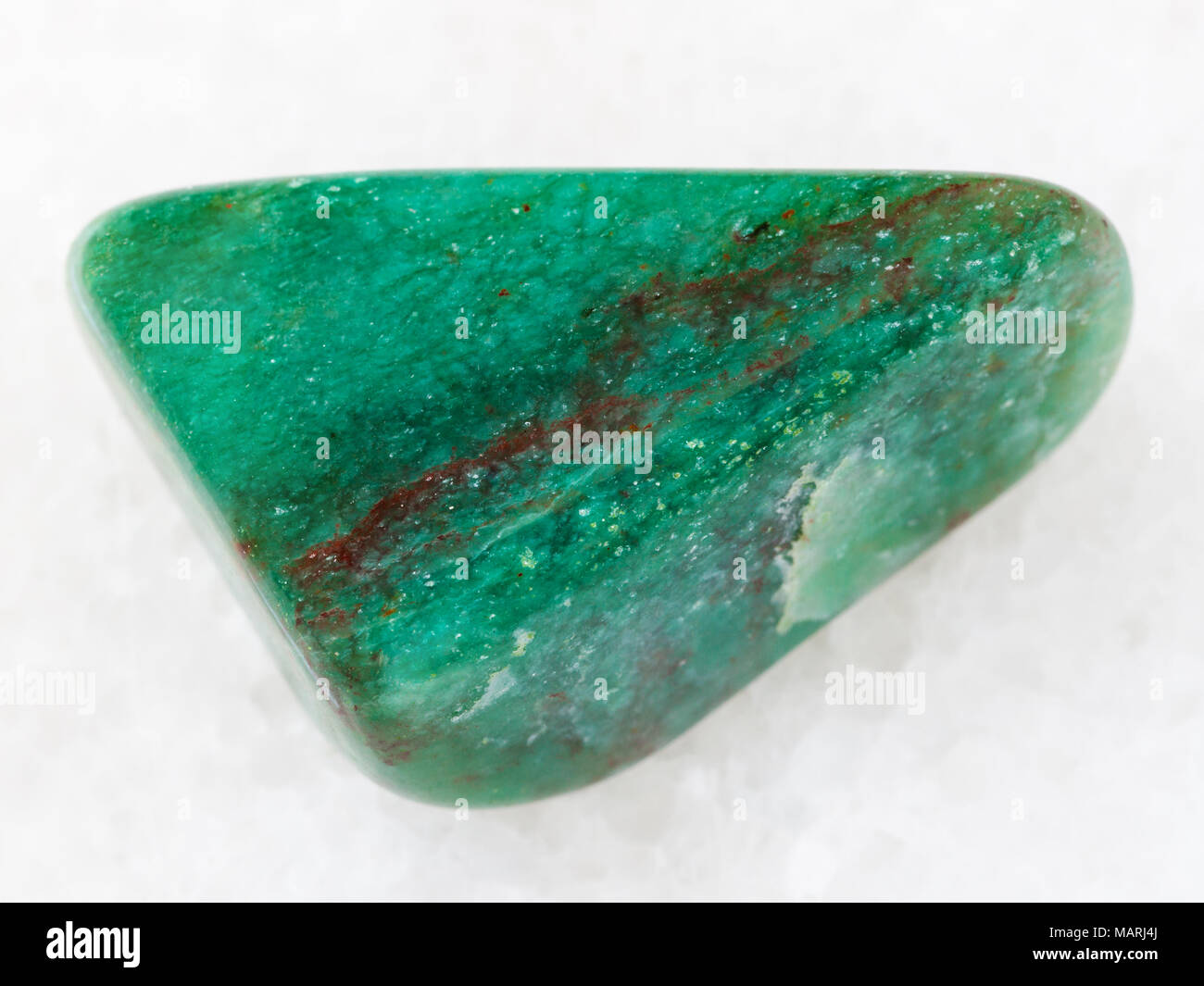 macro shooting of natural mineral rock specimen - tumbled fuchsite ...