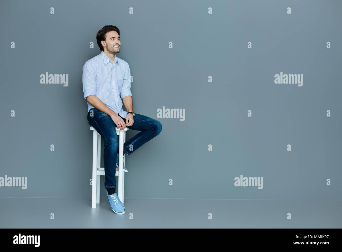 Man on stool hi-res stock photography and images - Alamy