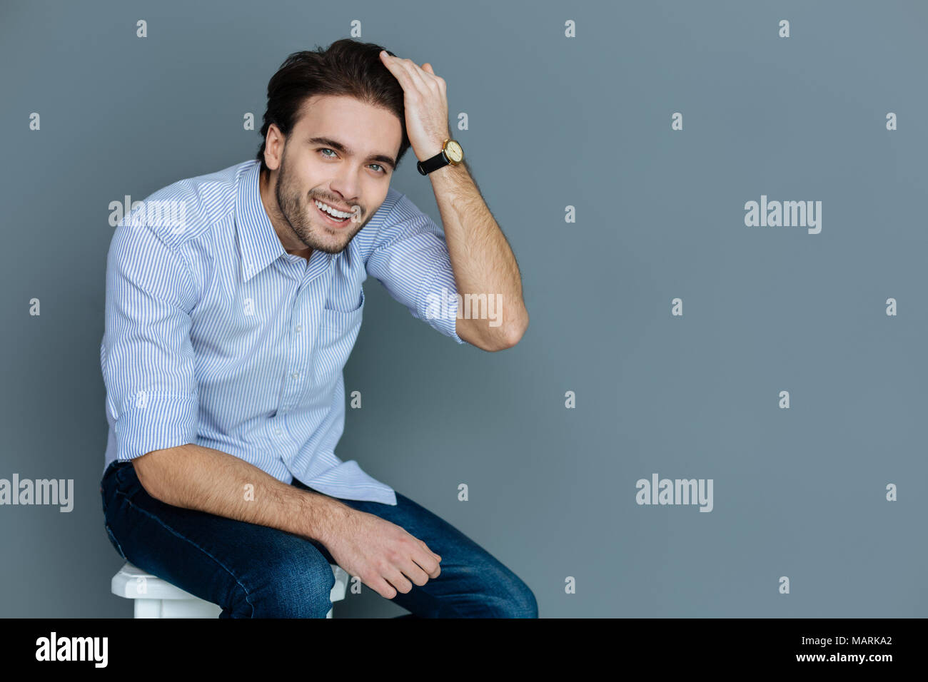 Cheerful bearded man fixing hi-res stock photography and images - Alamy