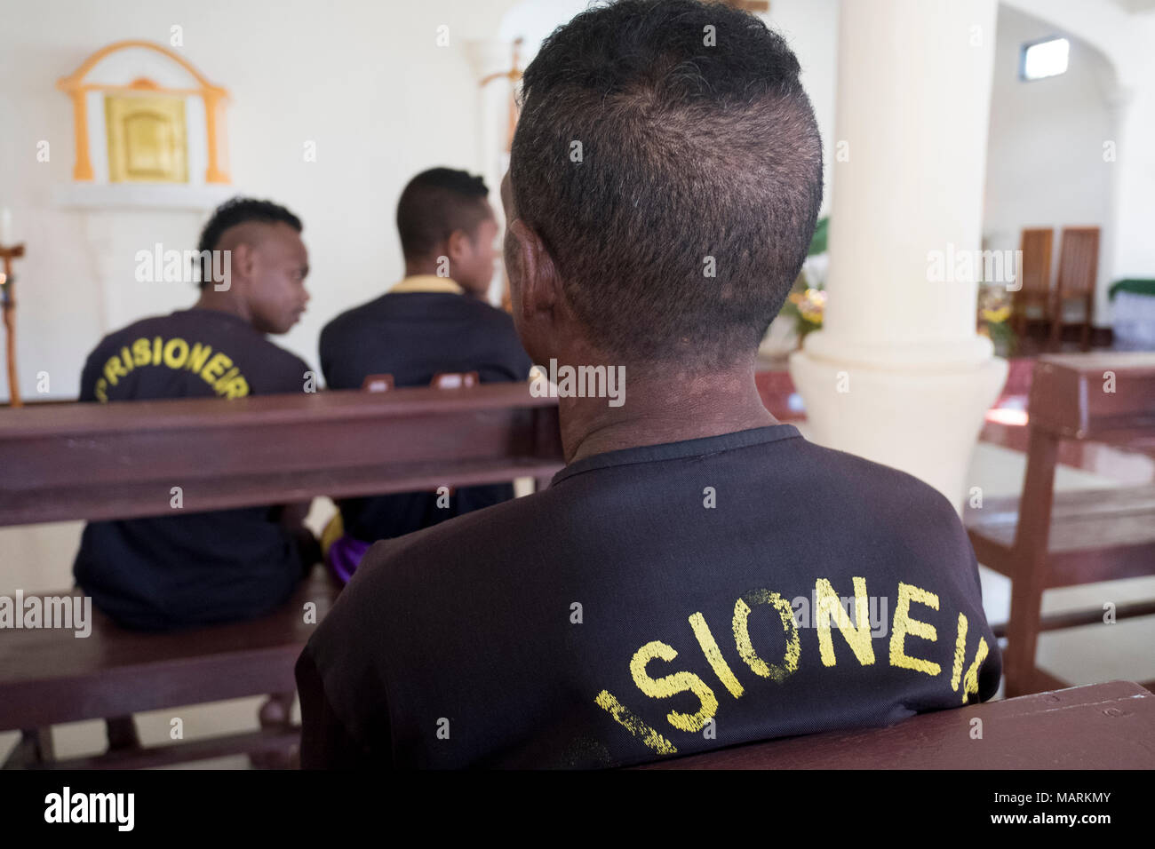 Prisoners pray in the chapel of the Gleno, jail in Ermera, Timor-Leste ...