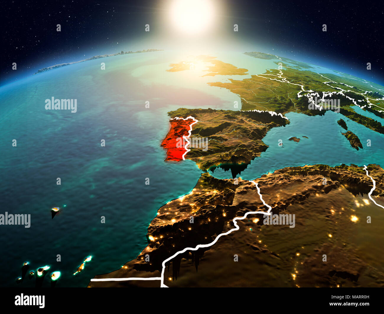 Sunrise above Portugal highlighted in red on model of planet Earth in ...