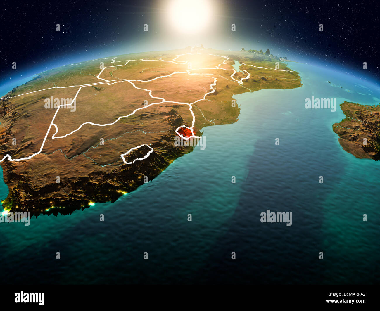 Sunrise above Swaziland highlighted in red on model of planet Earth in space with visible ...