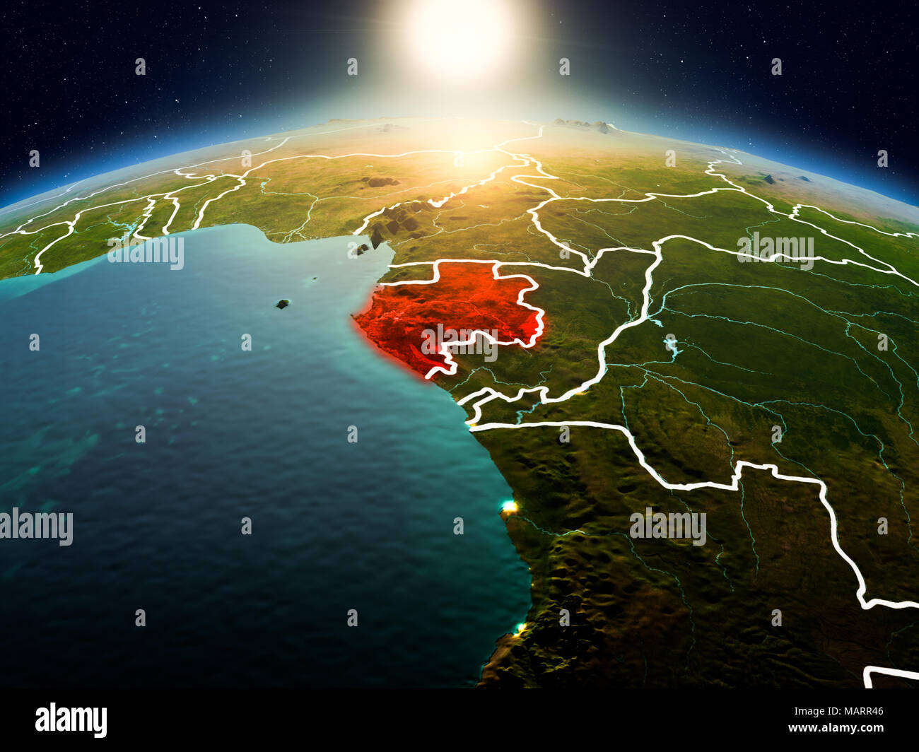 Sunrise above Gabon highlighted in red on model of planet Earth in space with visible country ...