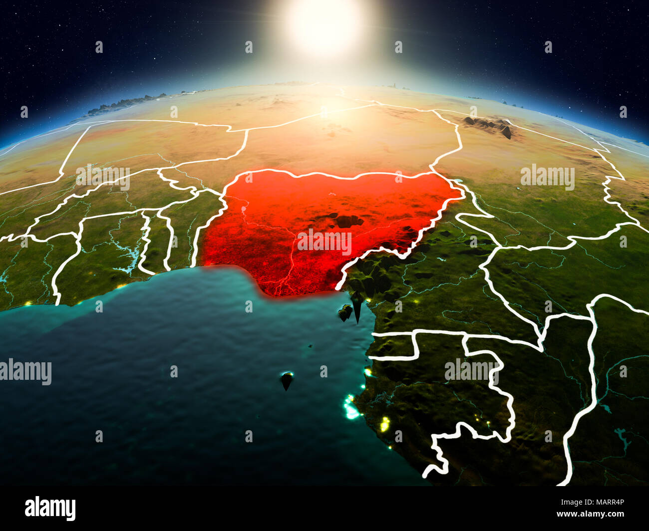 Sunrise above Nigeria highlighted in red on model of planet Earth in ...
