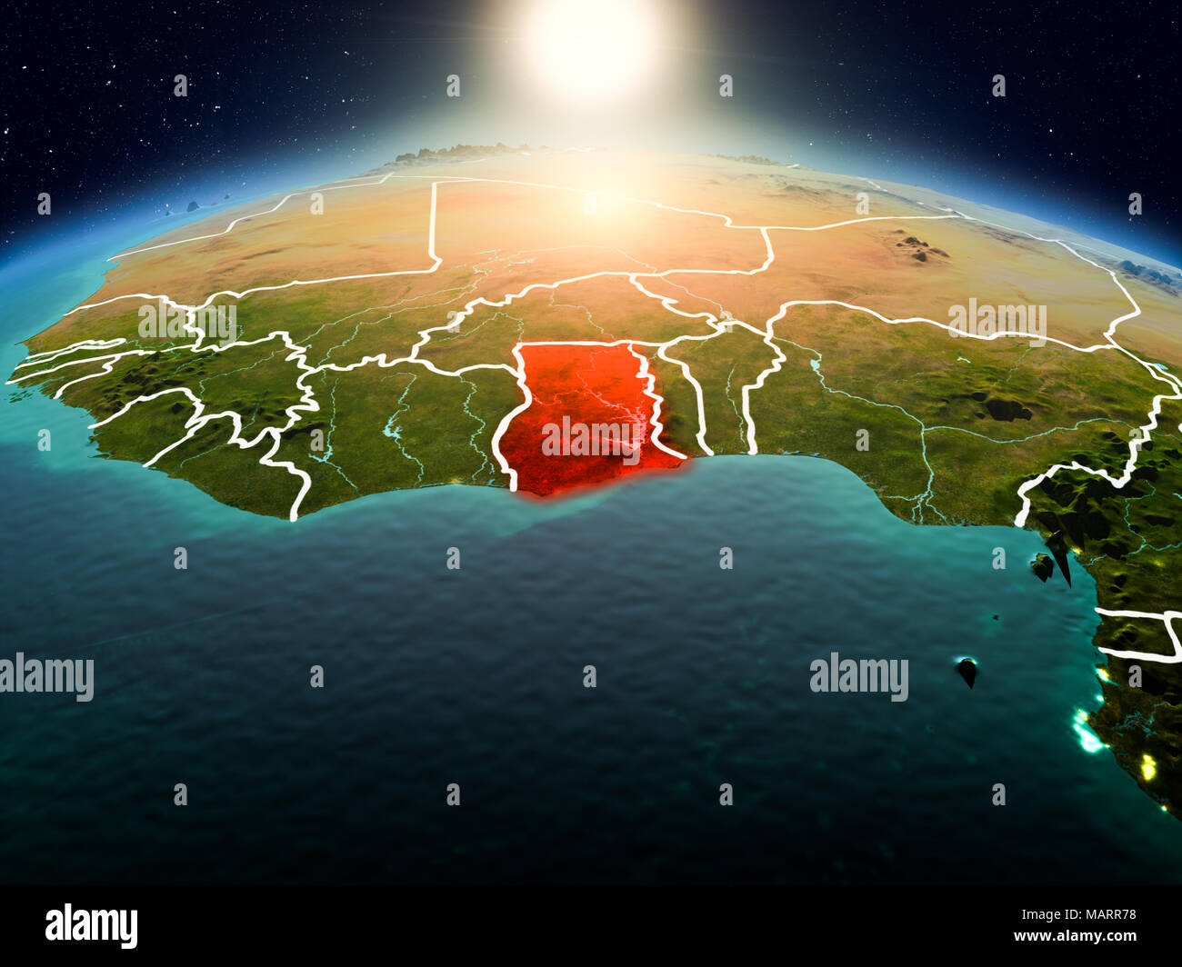 Sunrise above Ghana highlighted in red on model of planet Earth in ...