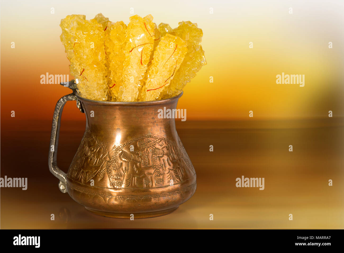 Close Up Of Saffron Rock Candy Sugar Crystal in A Traditional Copper ...