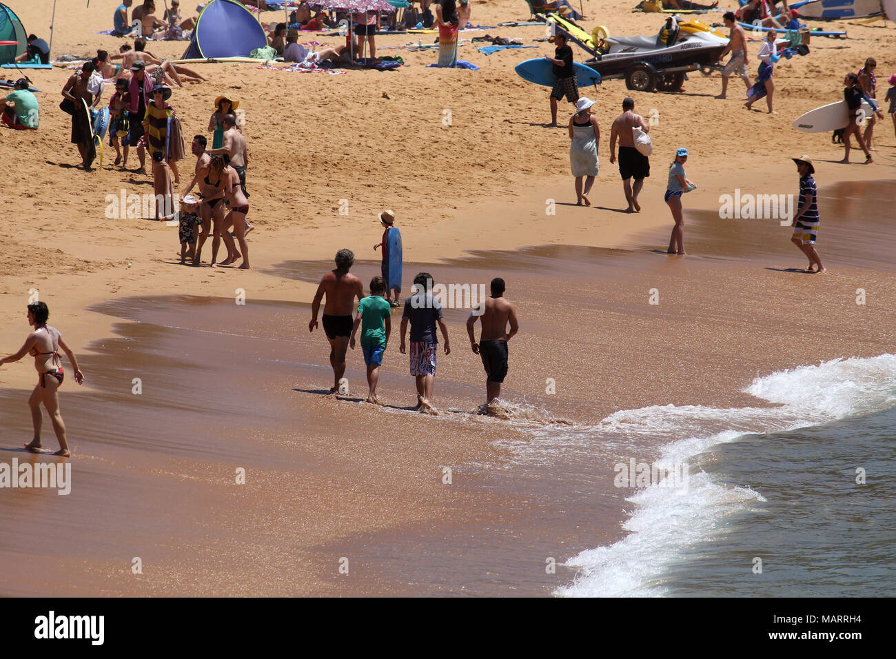 Holiday makers enjoy the beaches of Australia, cooling down in the ...