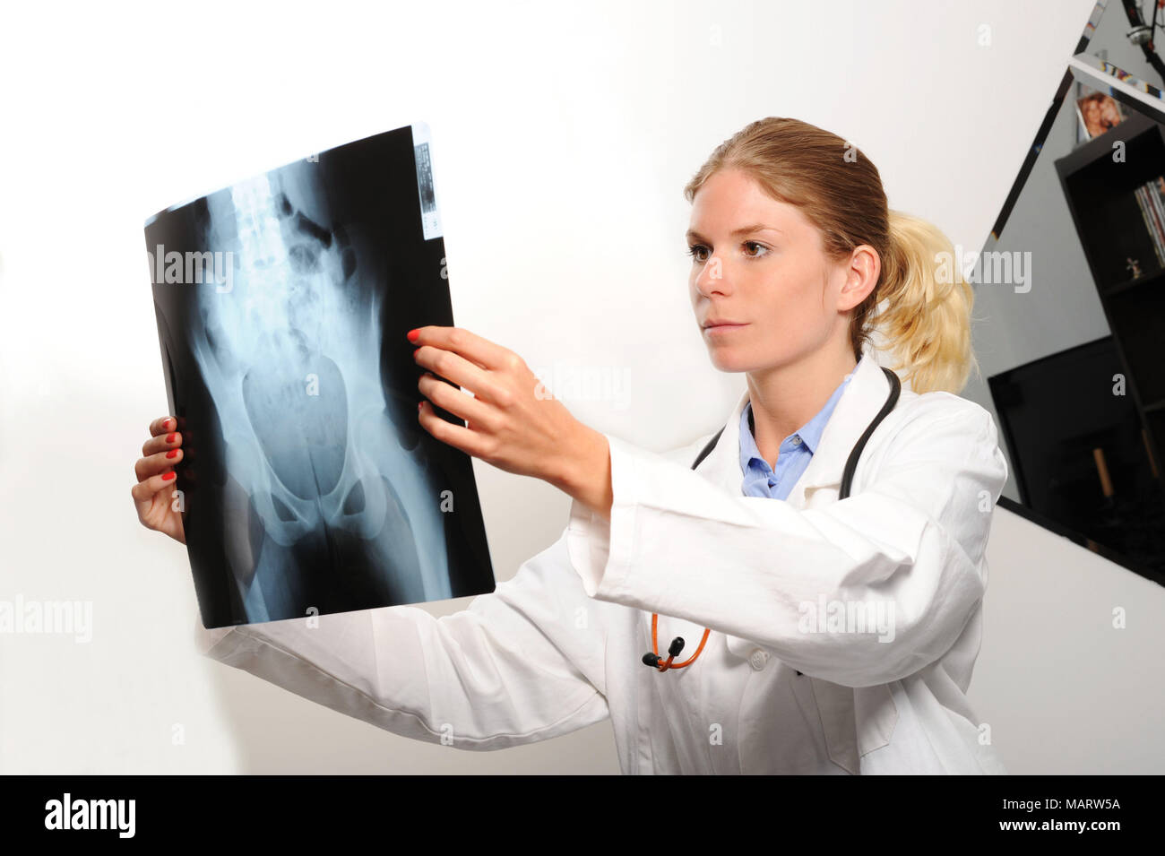 Female doctor examining an x-ray image Stock Photo - Alamy