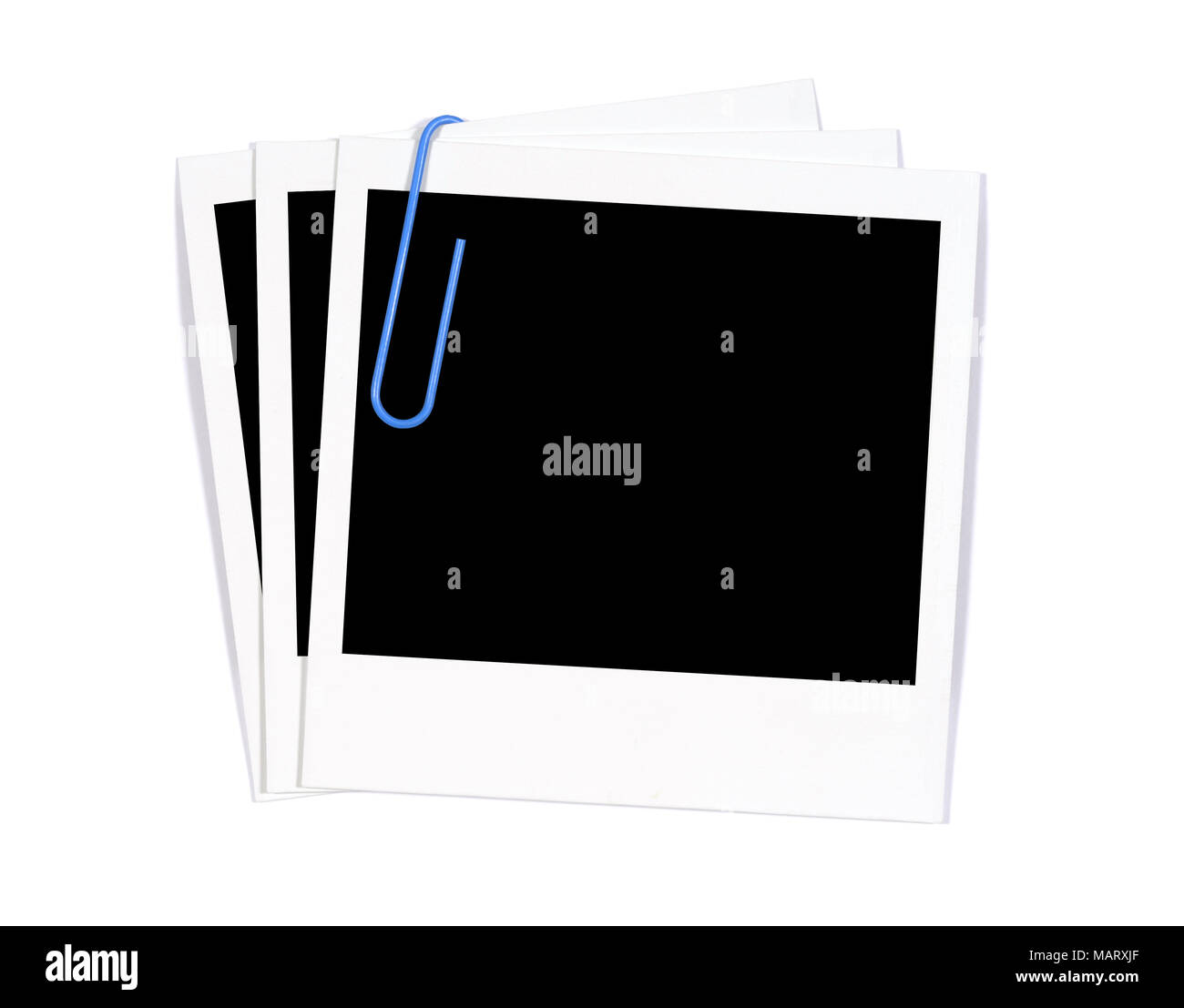 Group of instant photo prints with blue paperclip Stock Photo - Alamy