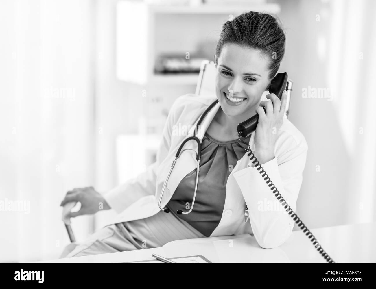 Doctor talking woman not man Black and White Stock Photos & Images - Alamy