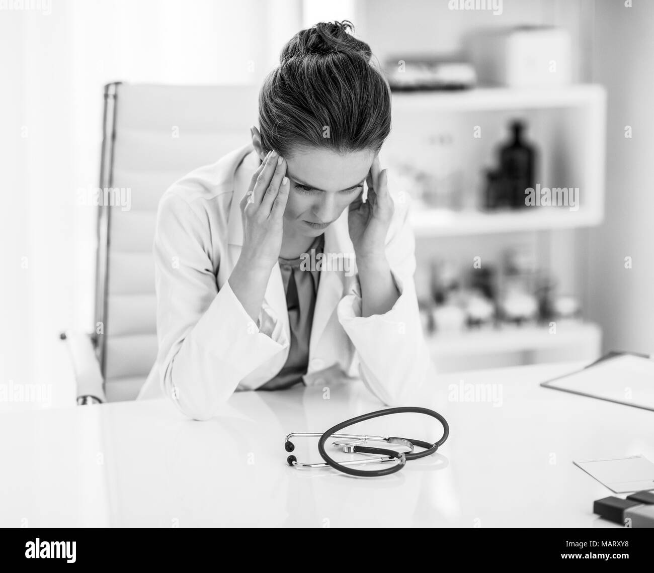 Frustrated doctor woman in office Stock Photo - Alamy