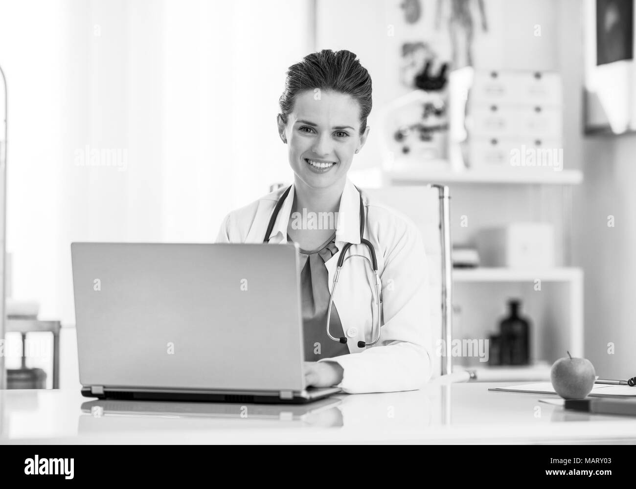 Medical doctor working laptop Black and White Stock Photos & Images - Alamy