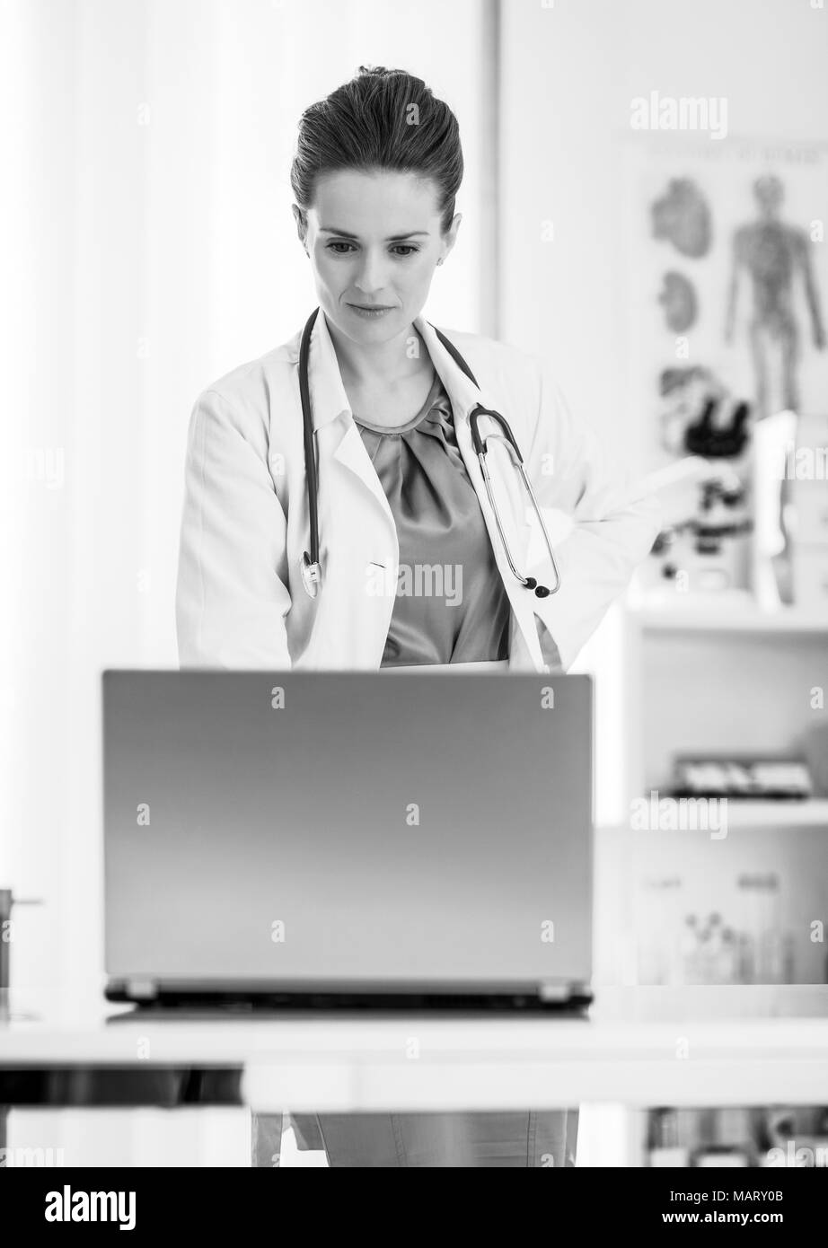 Medical doctor working laptop Black and White Stock Photos & Images - Alamy