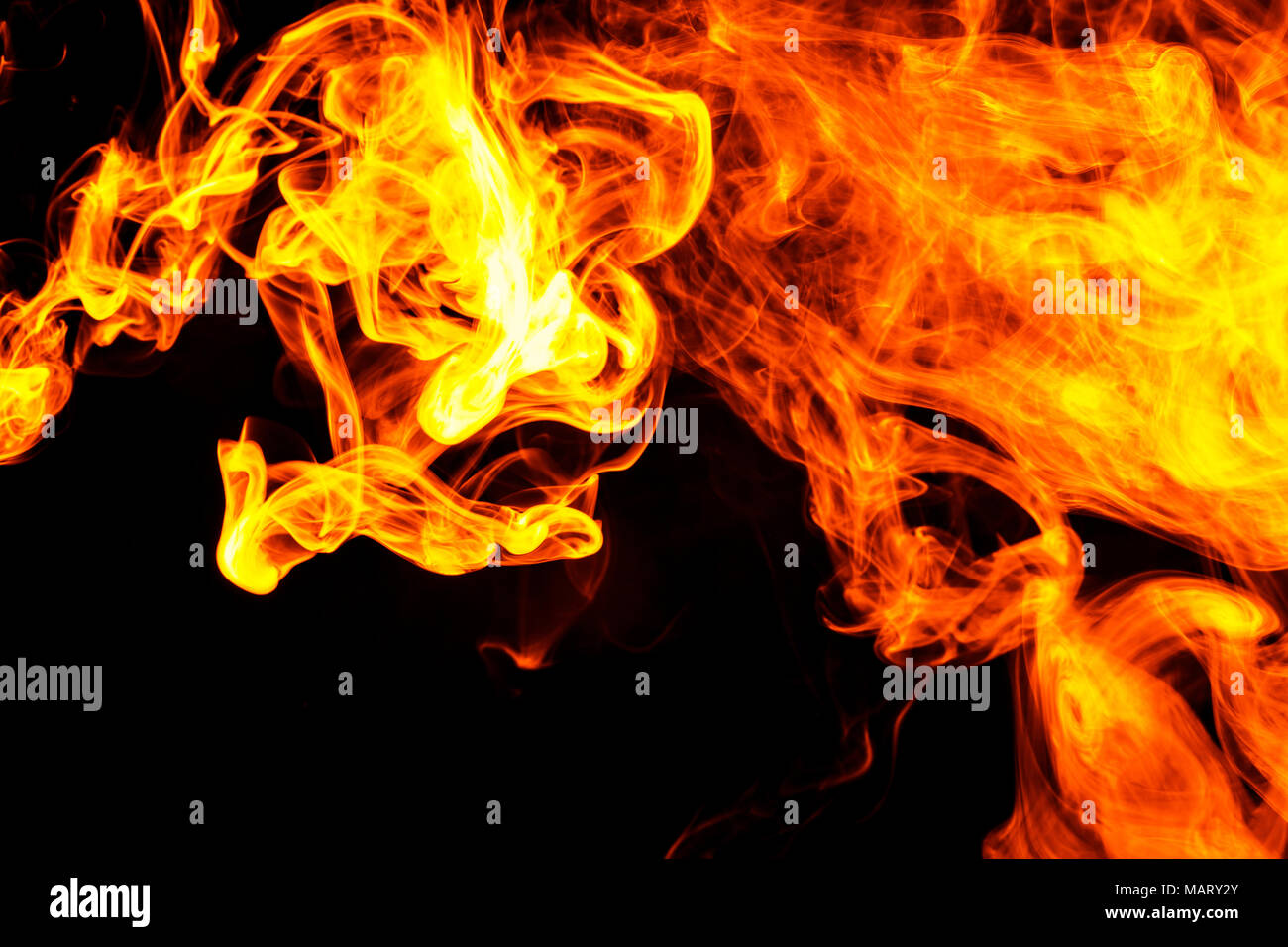 Fire flames background. Dense fiery smoke on a black isolated ...