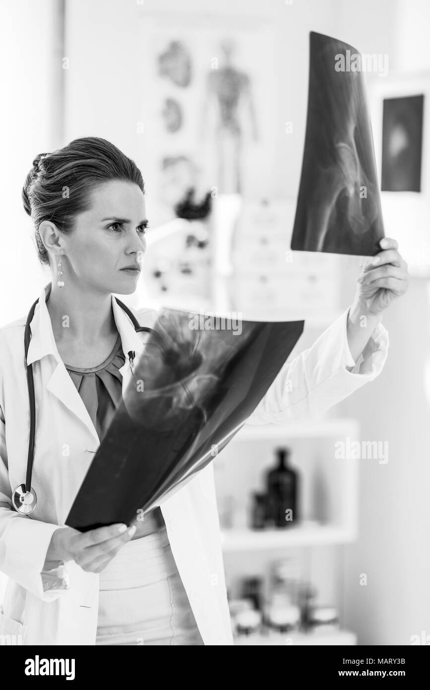 Medical doctor woman looking on fluorography in office Stock Photo - Alamy